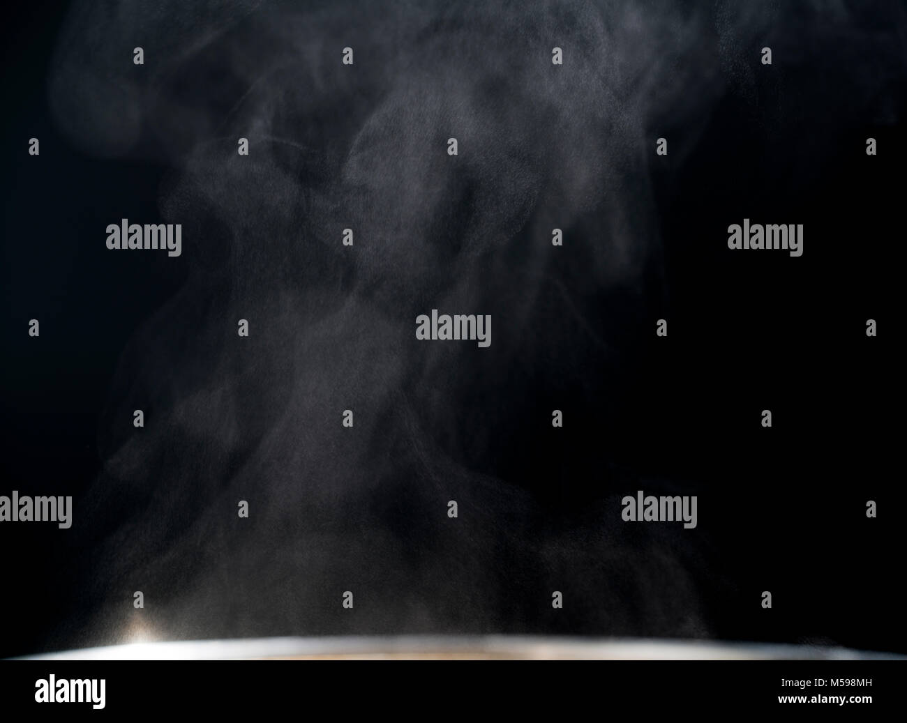 White and gray steaming on black abstract background with copy space ...