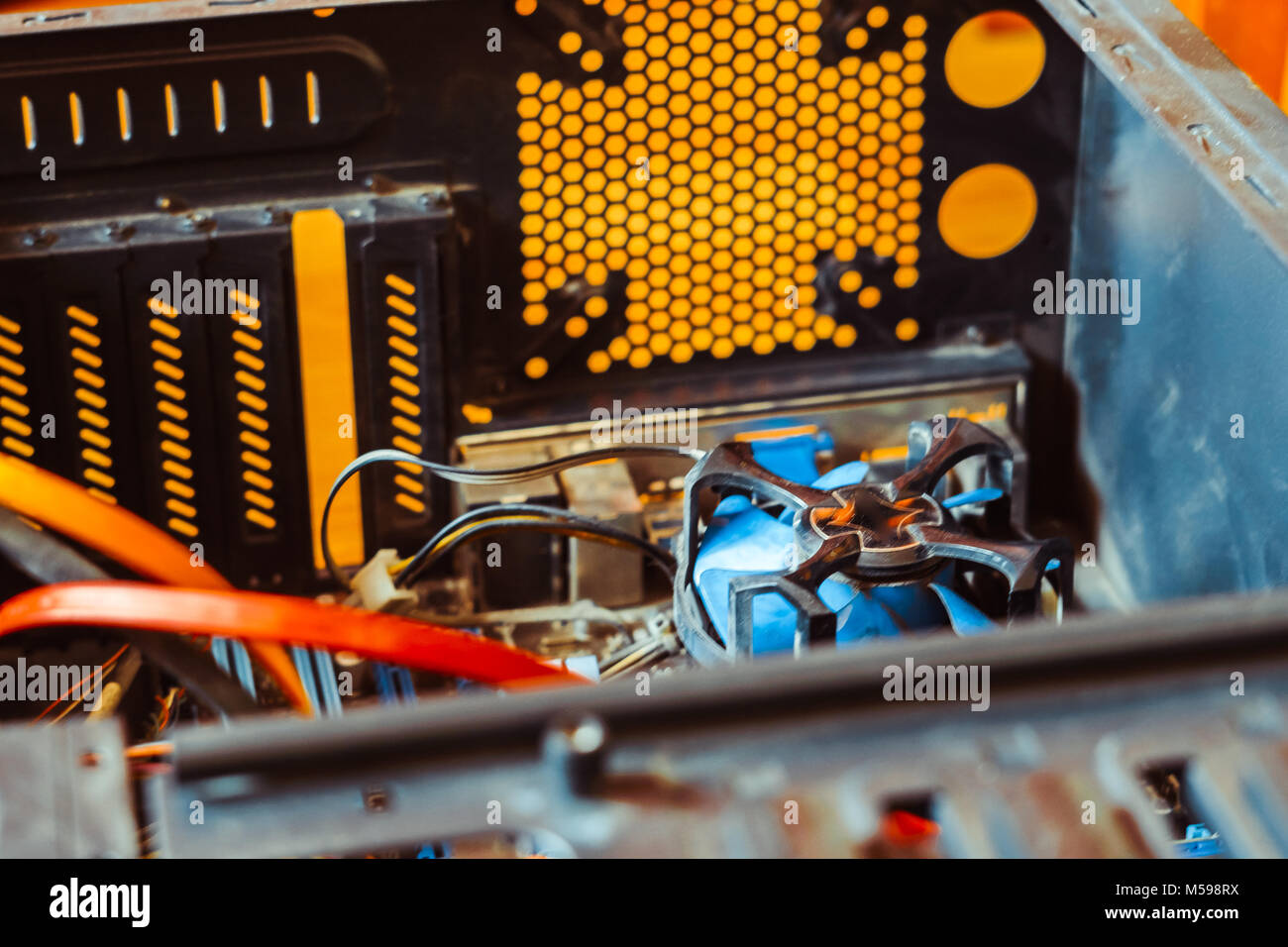Dust on the computer pc processor cooler with mainboard and computer case fragment. Selective ...