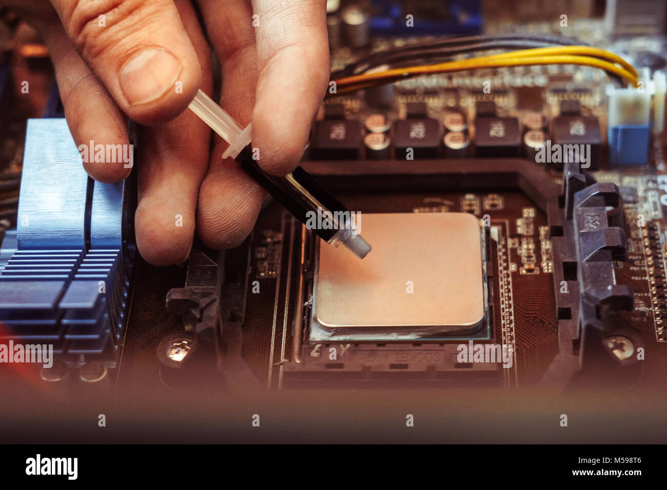 Thermal paste applied on a computer CPU Stock Photo - Alamy