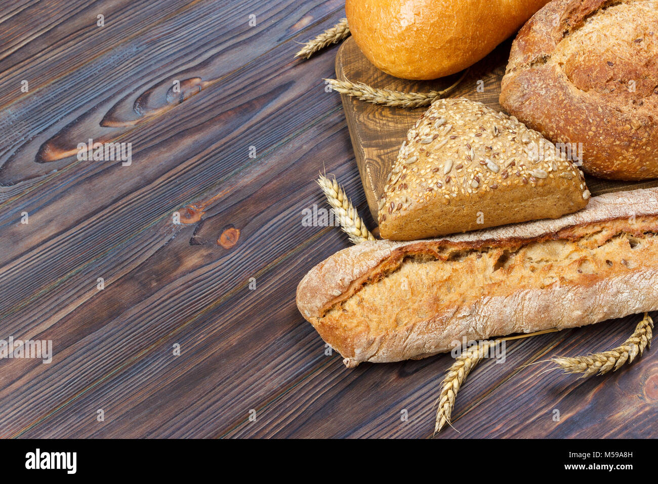 fresh bread and wheat on the wooden. top view with copy space Stock ...