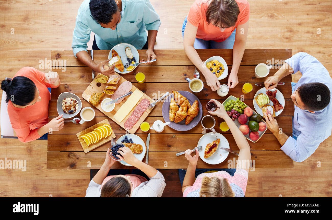 group of people having breakfast at table Stock Photo - Alamy
