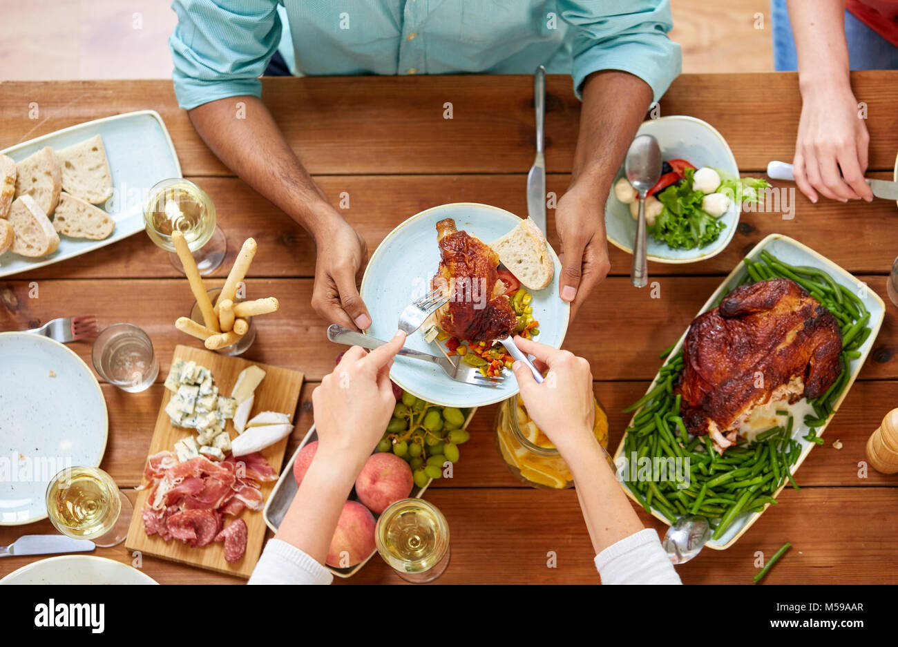 Couple eating chicken festive dinner hi-res stock photography and ...
