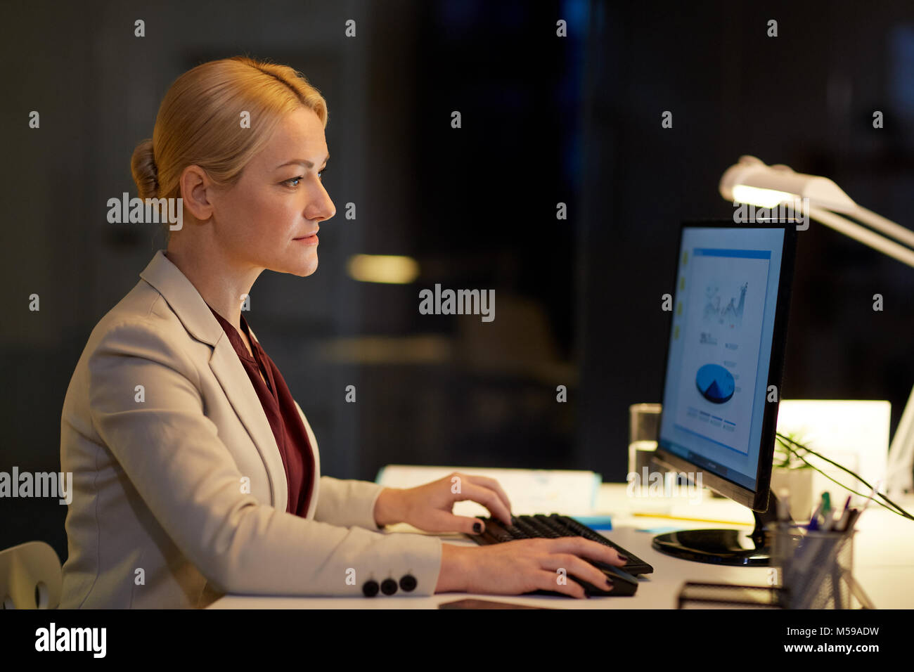 businesswoman at computer working at night office Stock Photo - Alamy