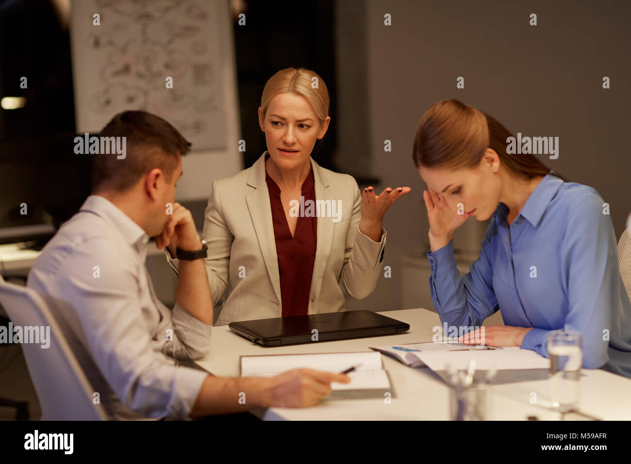 business team with laptop working late at office Stock Photo - Alamy