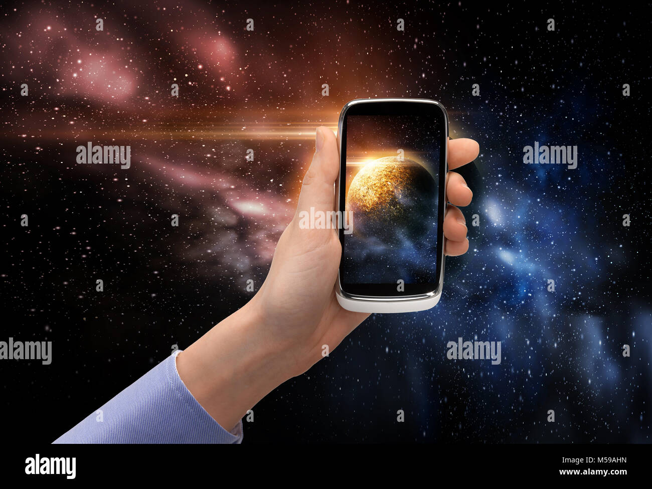hand with planet on smartphone screen over space Stock Photo - Alamy