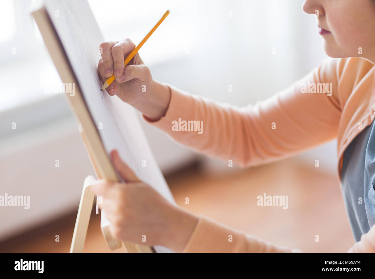 artist with pencil drawing picture at art studio Stock Photo - Alamy