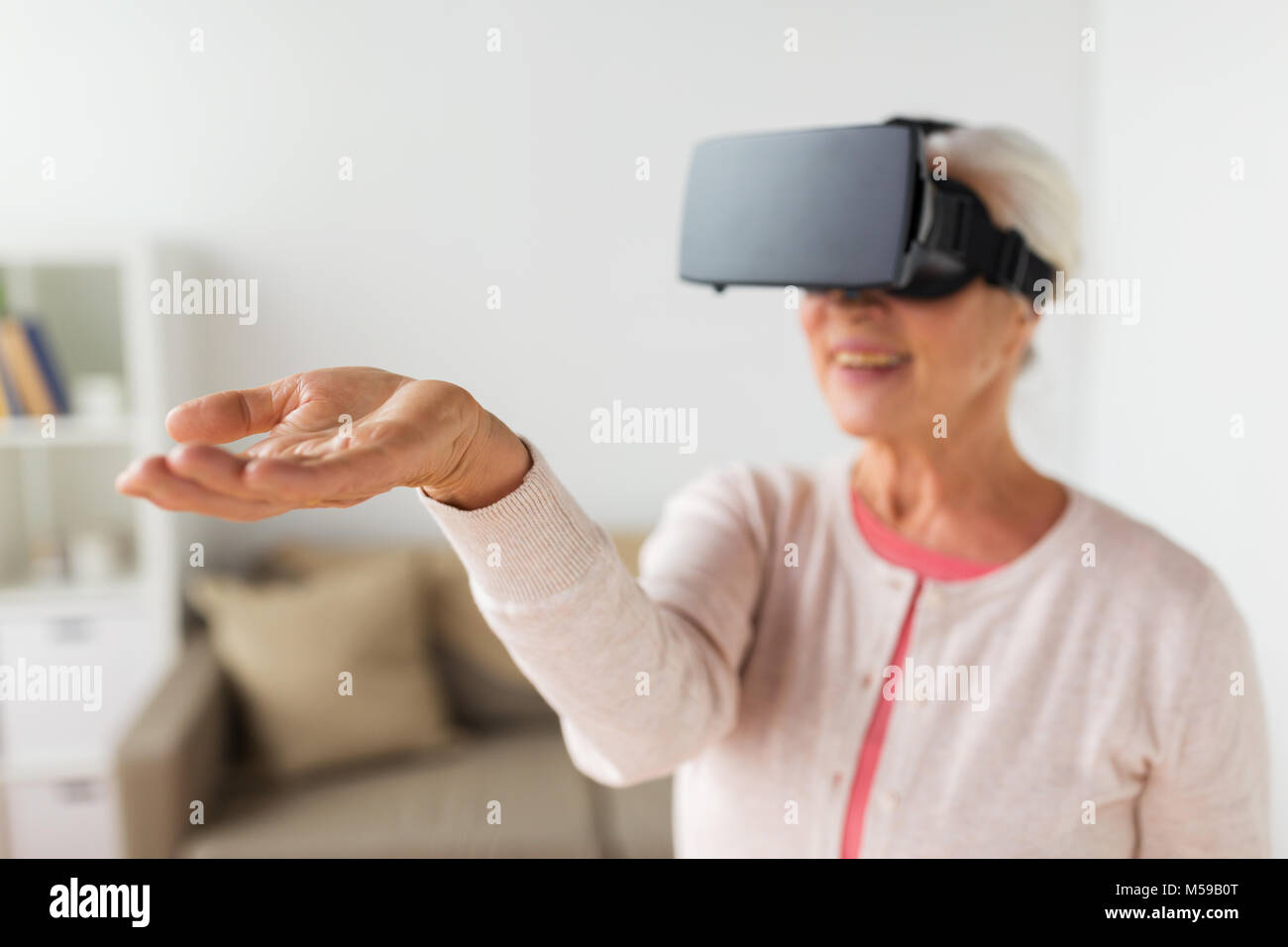 old woman in virtual reality headset or 3d glasses Stock Photo - Alamy