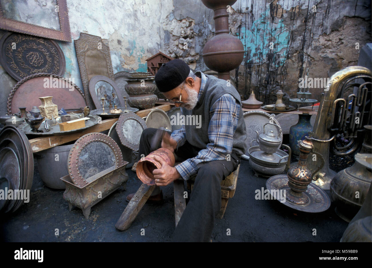 Libya. Tripoli. Old City. Coppersmith making copper objects Stock Photo ...