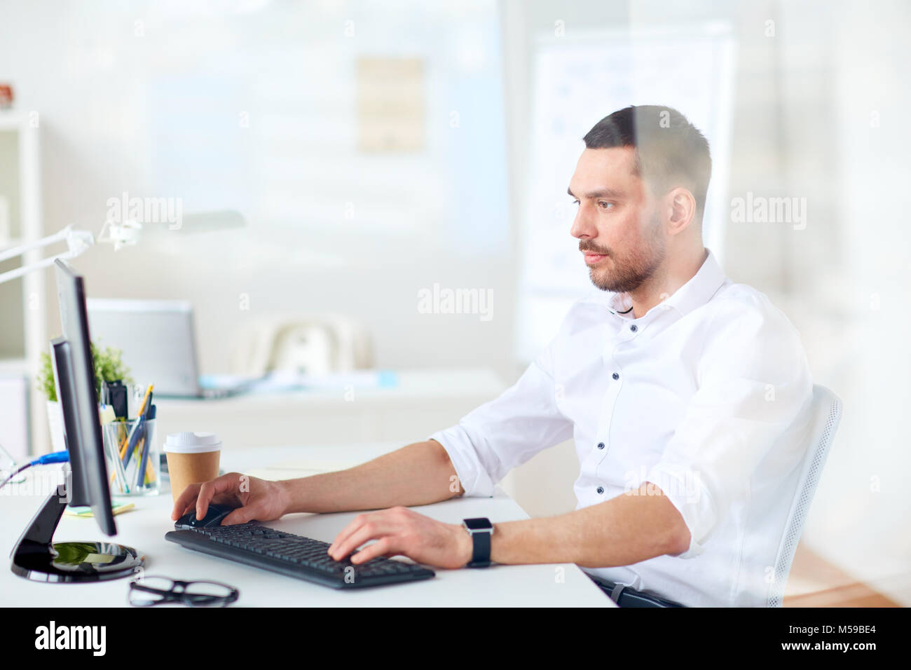 businessman typing on computer keyboard at office Stock Photo - Alamy