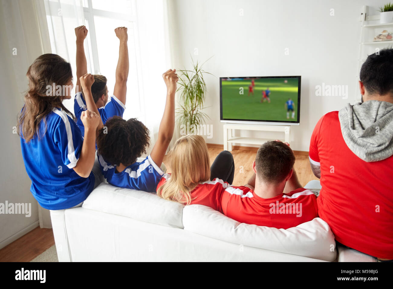 Back view couple watching soccer hi-res stock photography and images ...