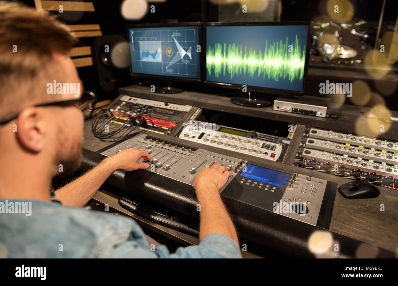 man at mixing console in music recording studio Stock Photo - Alamy