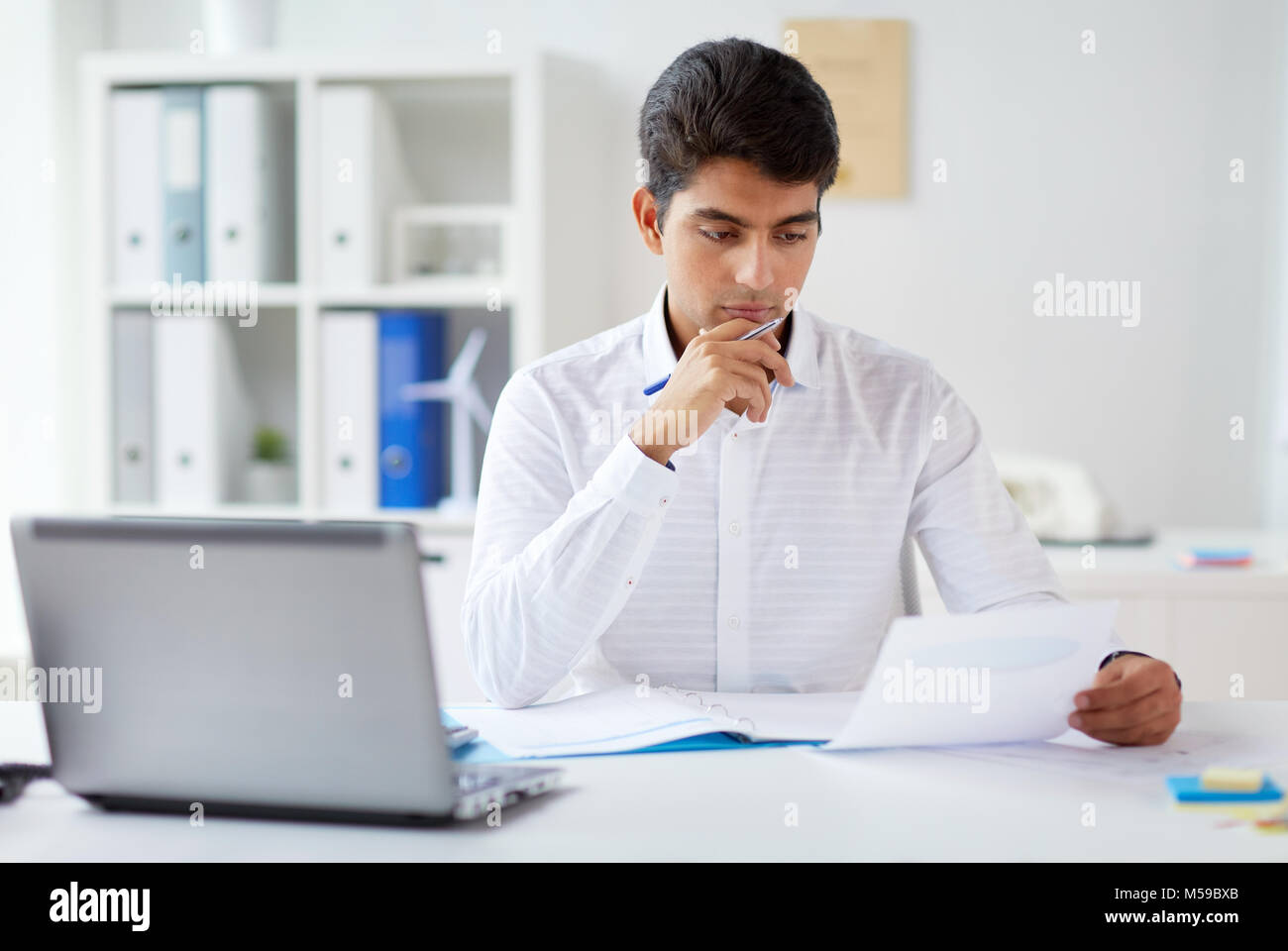 businessman working with papers at office Stock Photo - Alamy