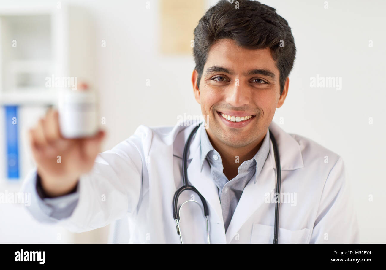 happy doctor with stethoscope and medication Stock Photo - Alamy