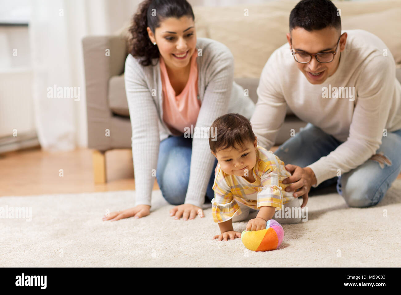 happy family and baby daugter playing at home Stock Photo - Alamy