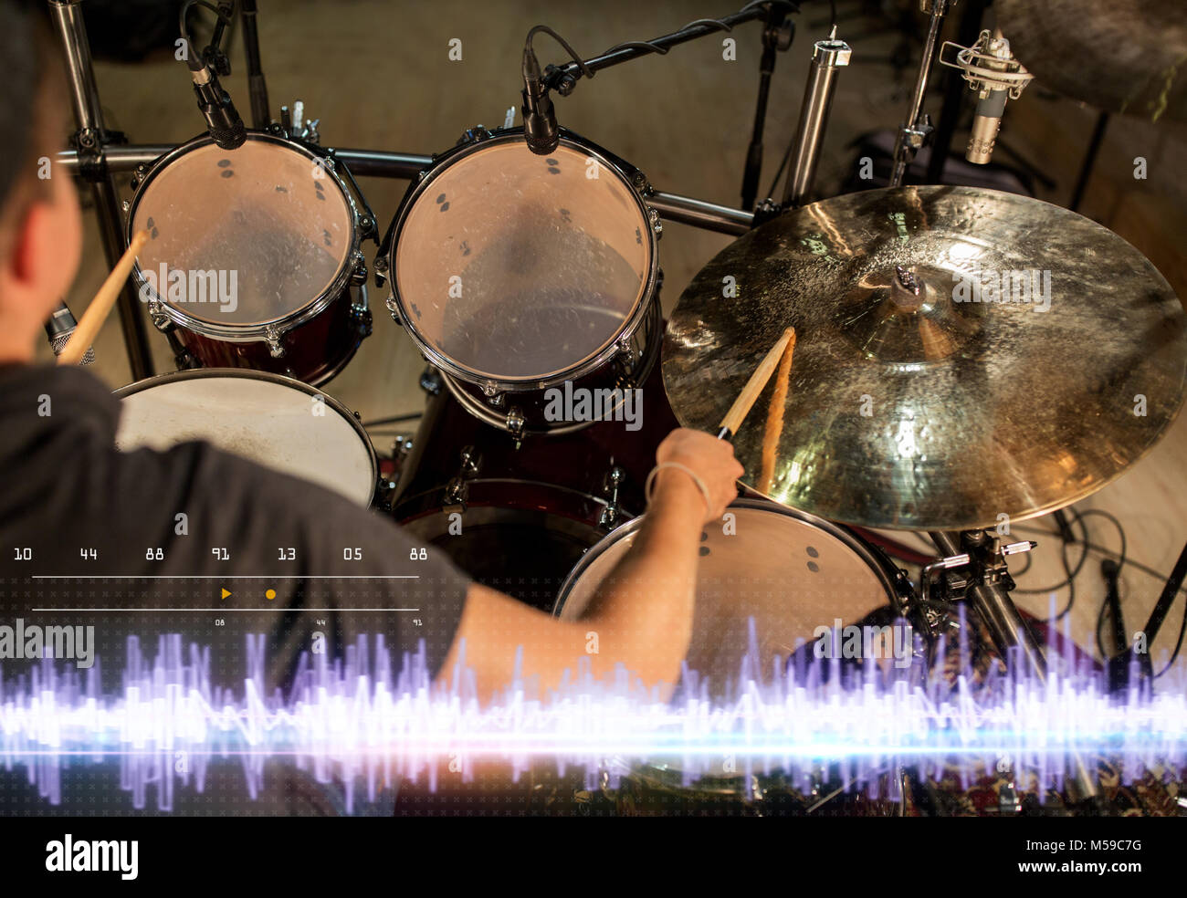drummer playing drum kit at sound recording studio Stock Photo - Alamy