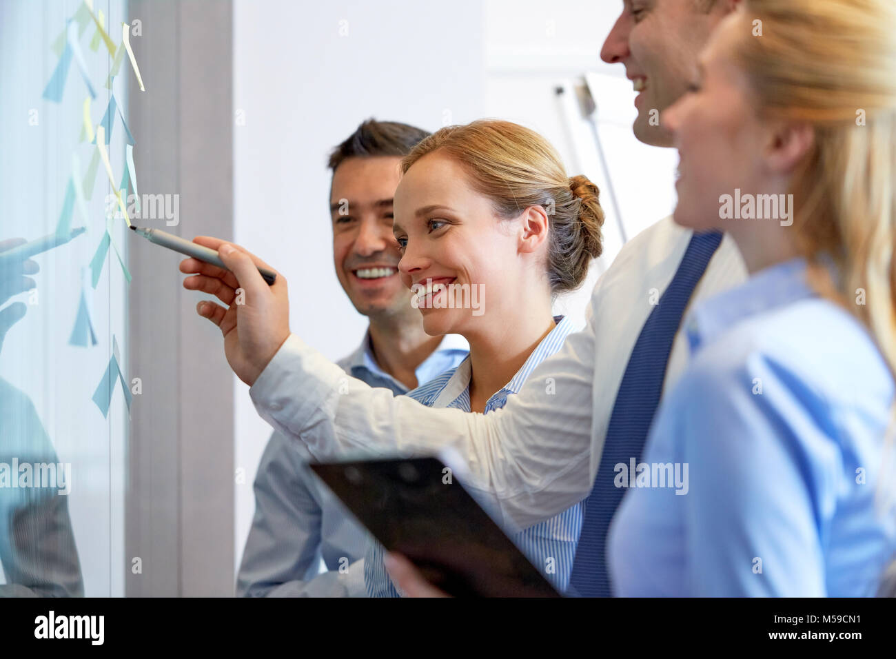business team with marker writing sticky notes Stock Photo - Alamy