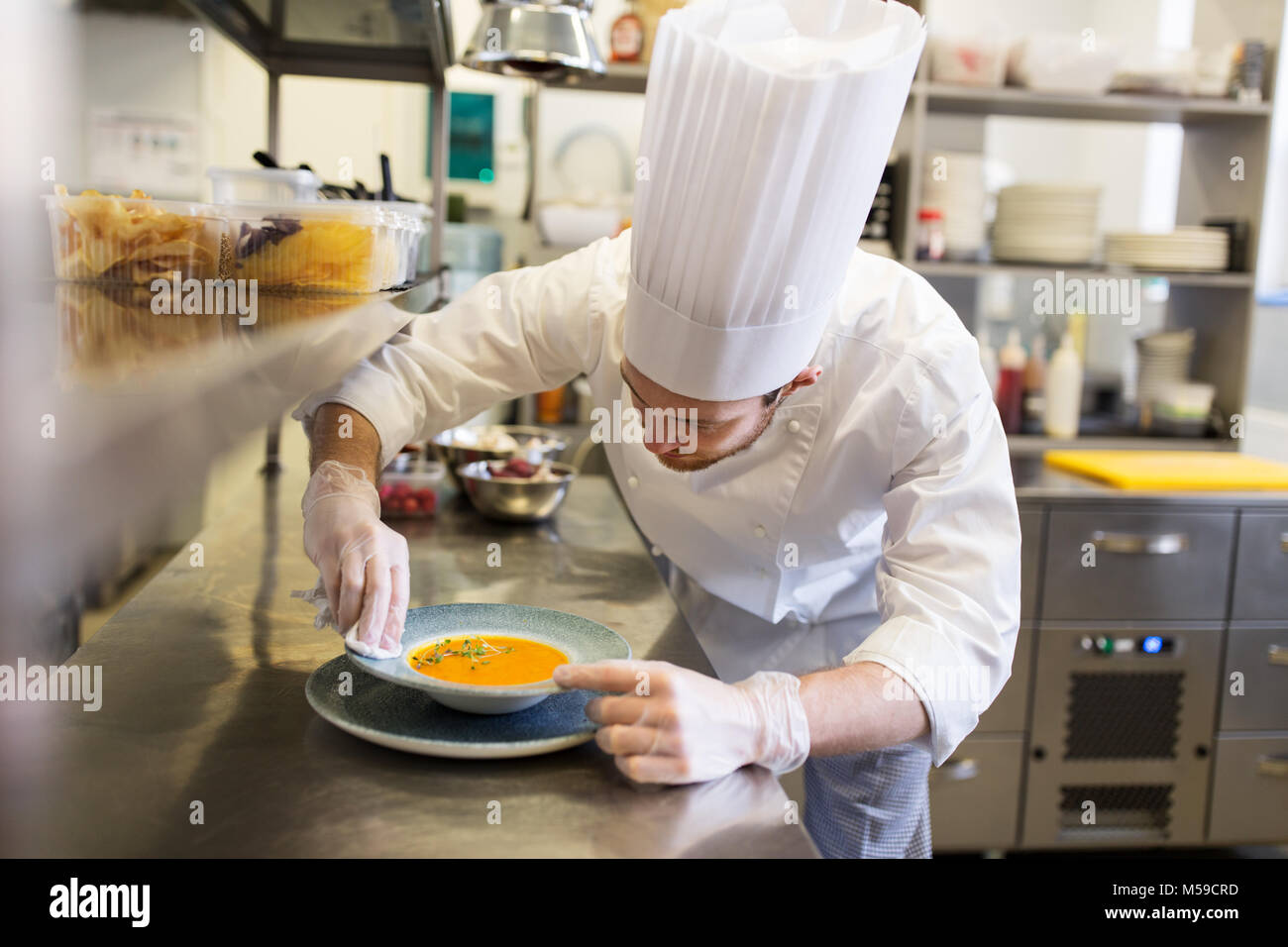 happy male chef cooking food at restaurant kitchen Stock Photo - Alamy