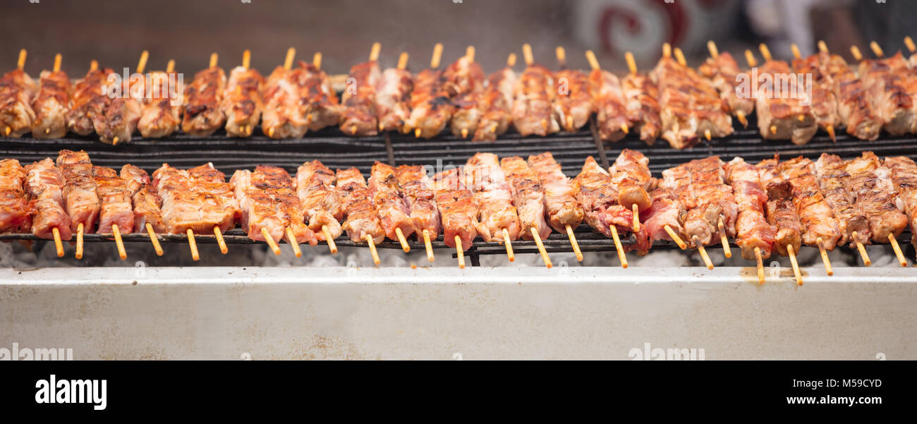 Meat skewers souvlaki on barbecue. Traditional meat on skewer cooking ...
