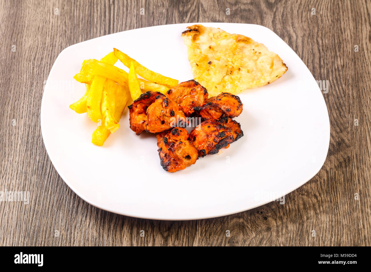 Indian traditional cuisine - Tandoori chicken with naan Stock Photo - Alamy