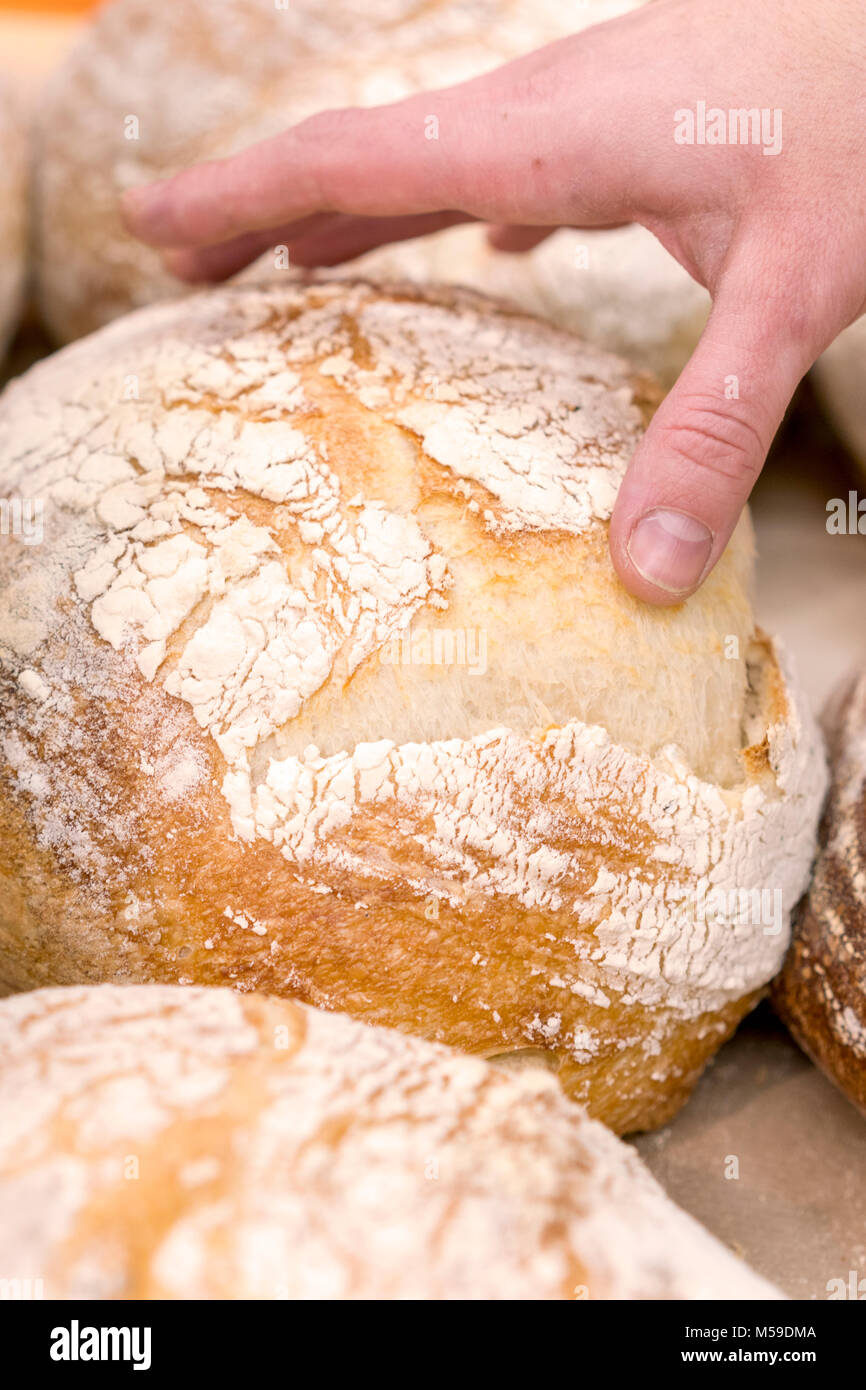 Hand reachning for bread in the store Stock Photo - Alamy