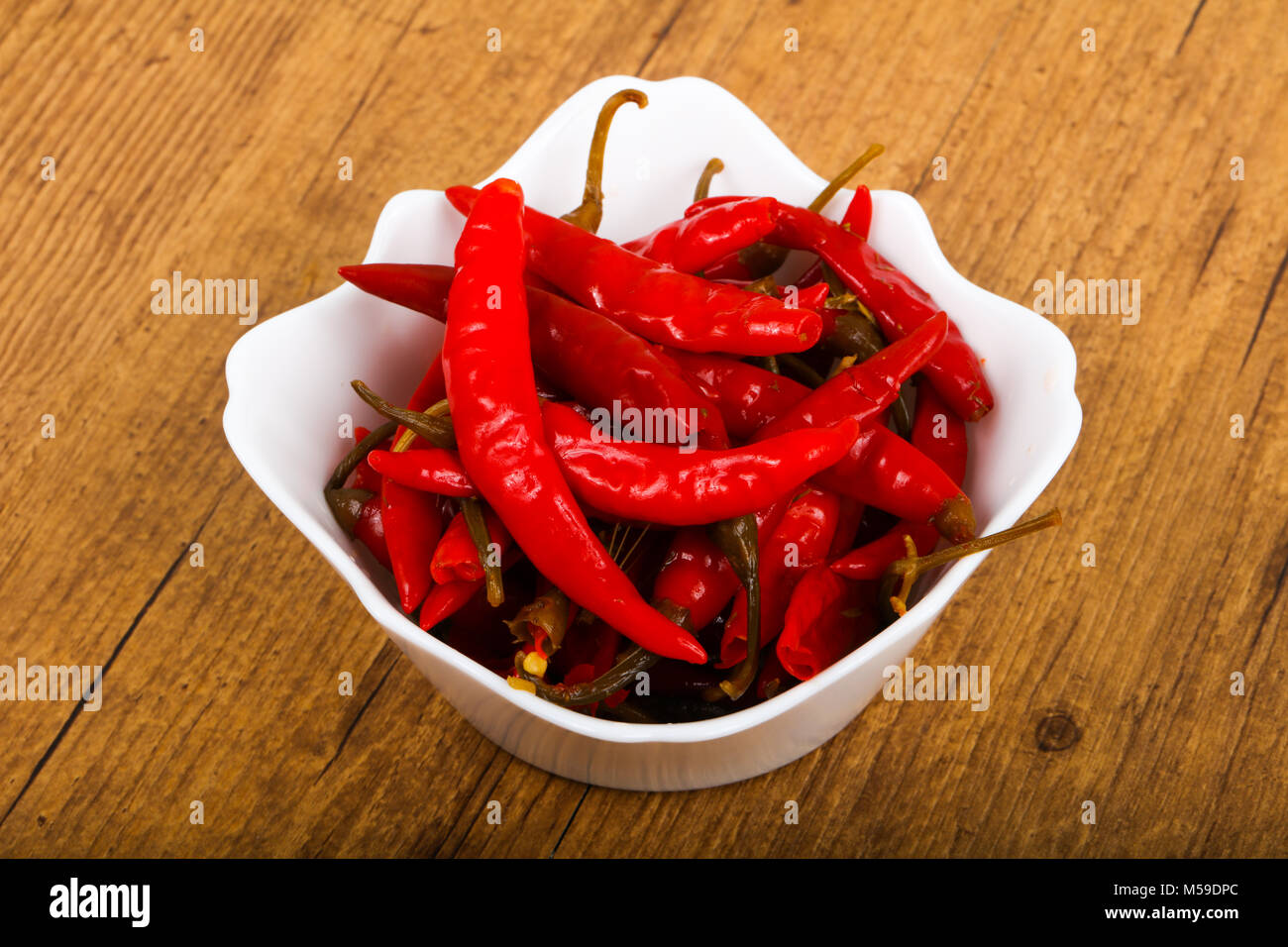Pickled chili peppers Stock Photo - Alamy