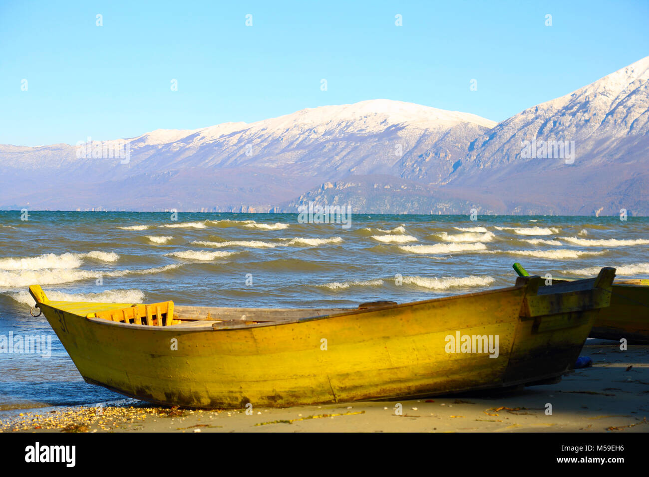 Wooden fishing boat moored on the beach of Lake Ohrid in Pogradec ...