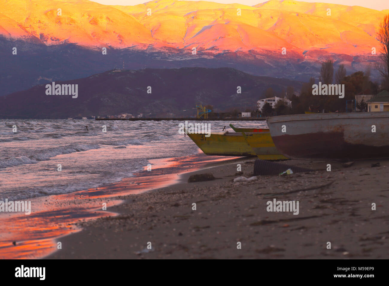 Wooden fishing boat moored on the beach of Lake Ohrid in Pogradec ...