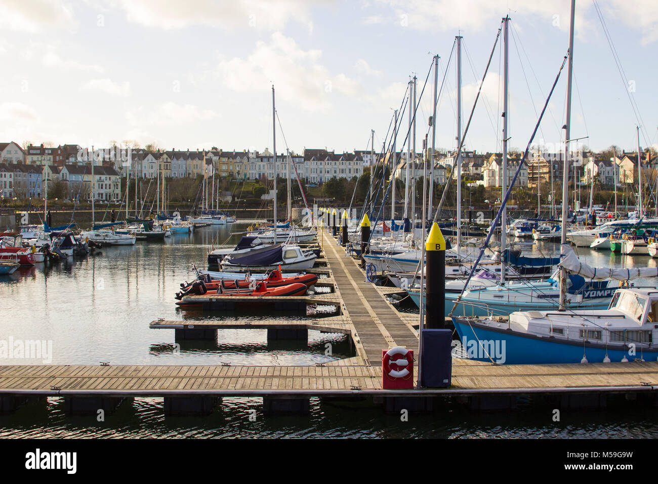 Yachts and power boats on their moorings in the modern marina in County ...