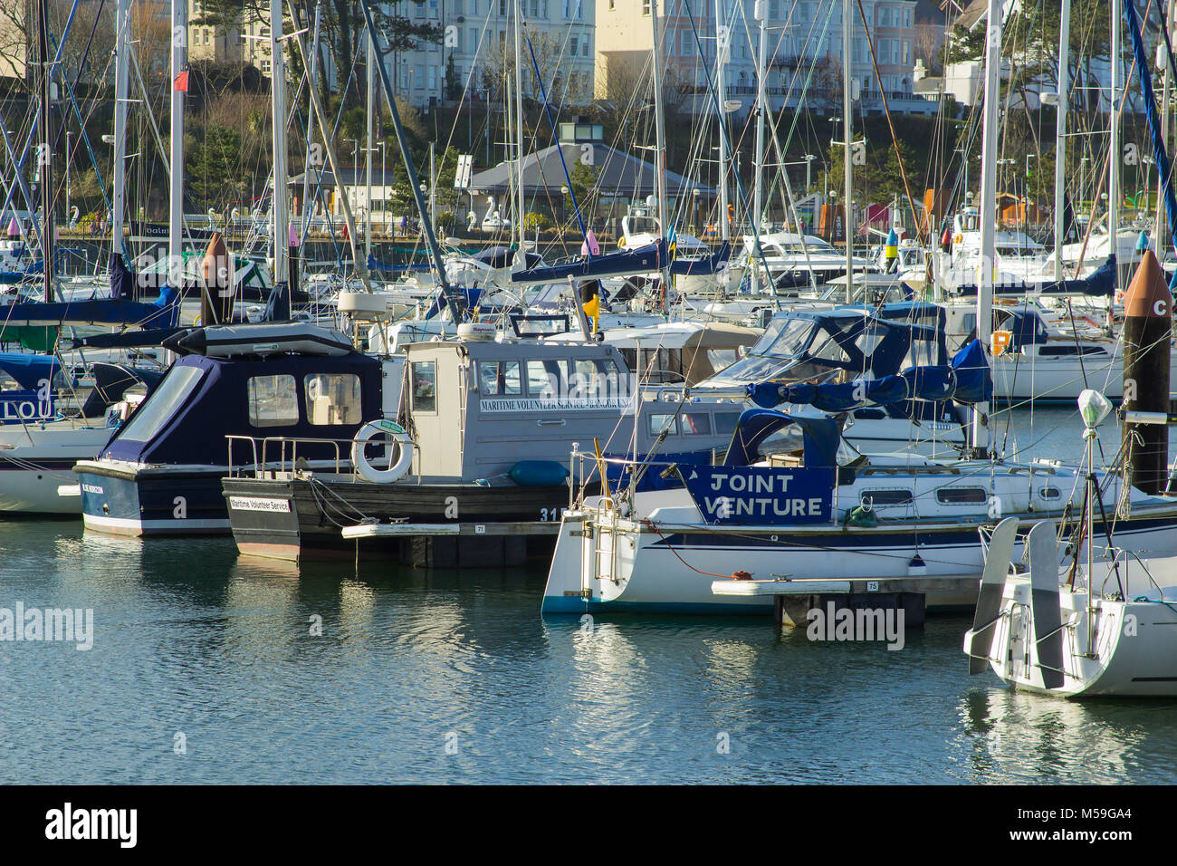 Yachts and power boats on their moorings in the modern marina in County ...