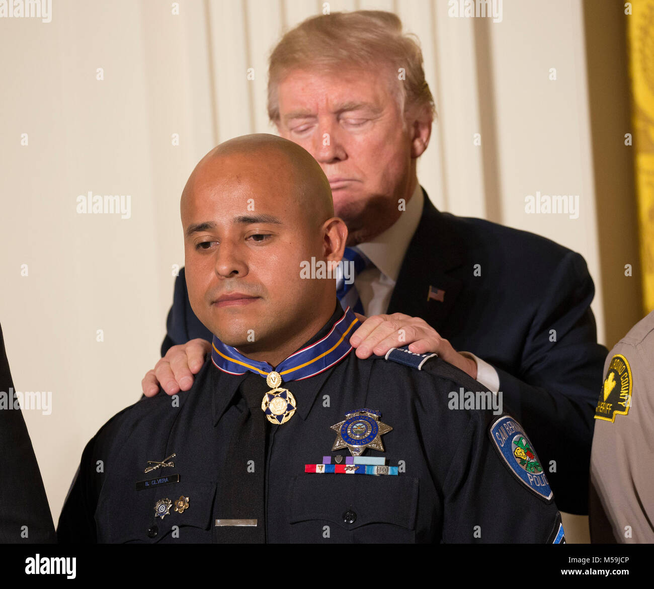 United States President Donald J. Trump presents Detective Brian Olvera ...