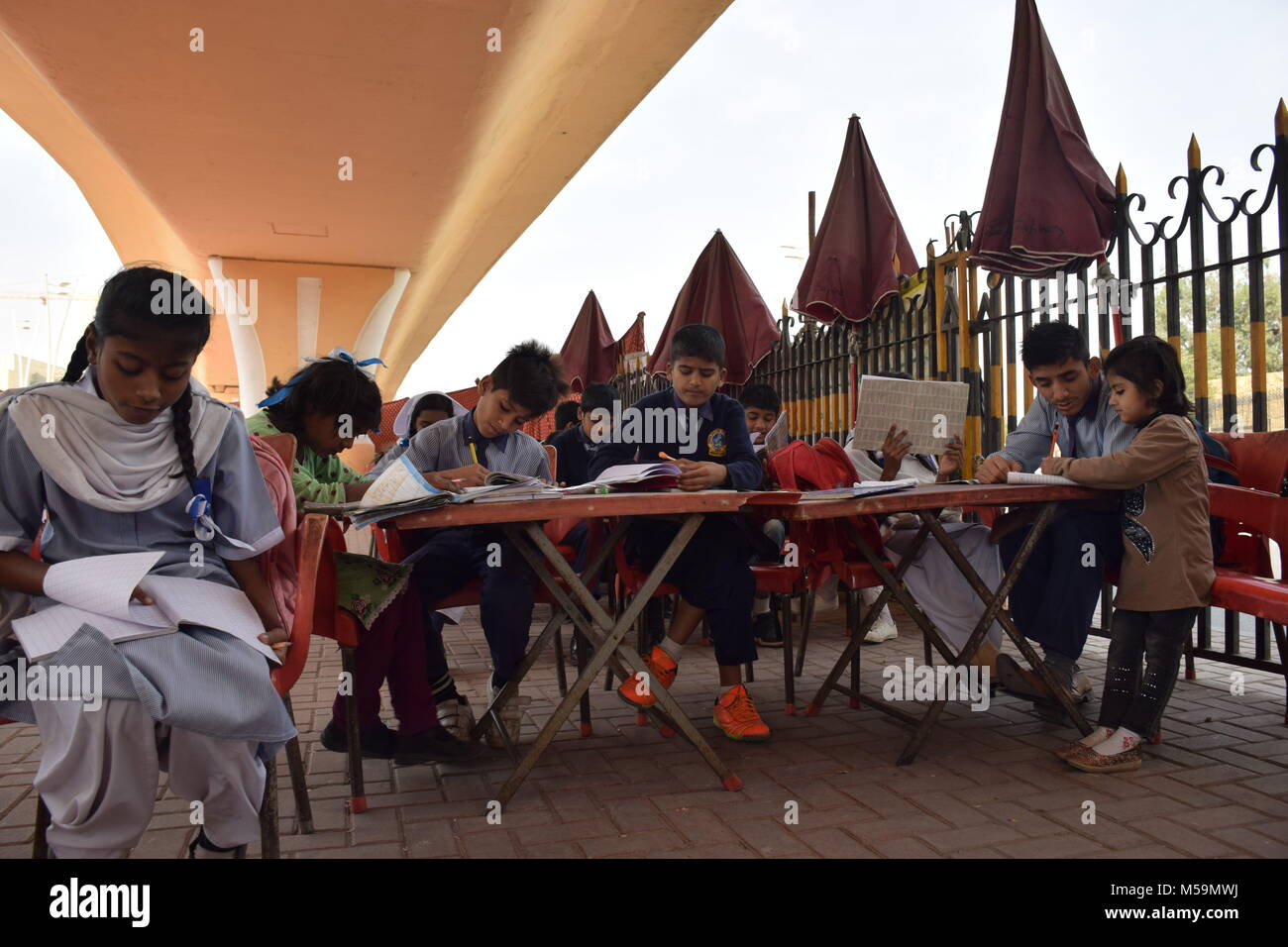 Karachi, Sindh, Pakistan. 13th Feb, 2018. Street children seen doing ...