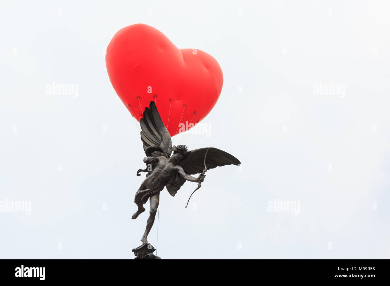 Piccadilly Circus, London, 21st Feb 2018. A chubby heart appears over ...