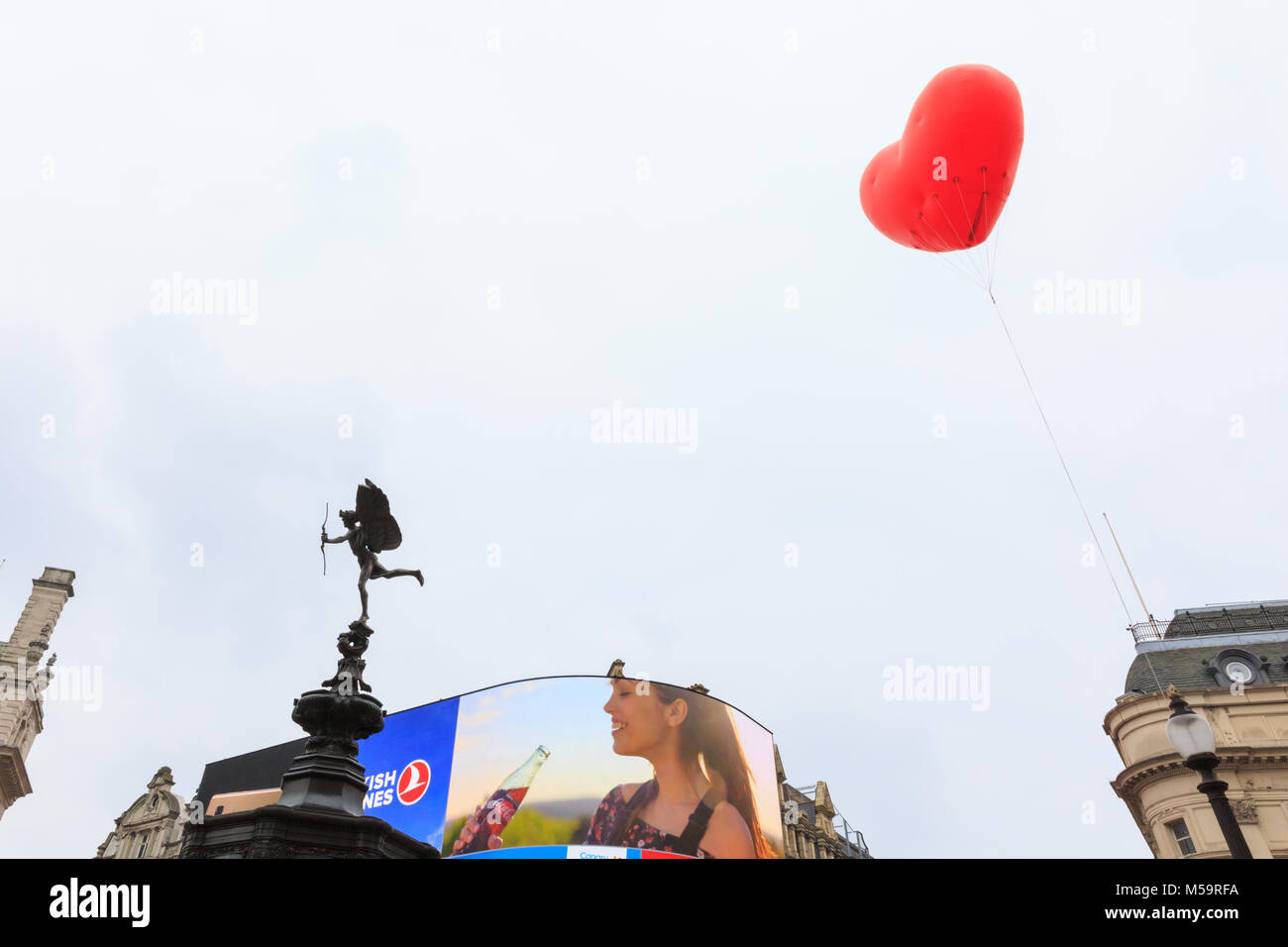 Piccadilly Circus, London, 21st Feb 2018. A chubby heart appears over ...