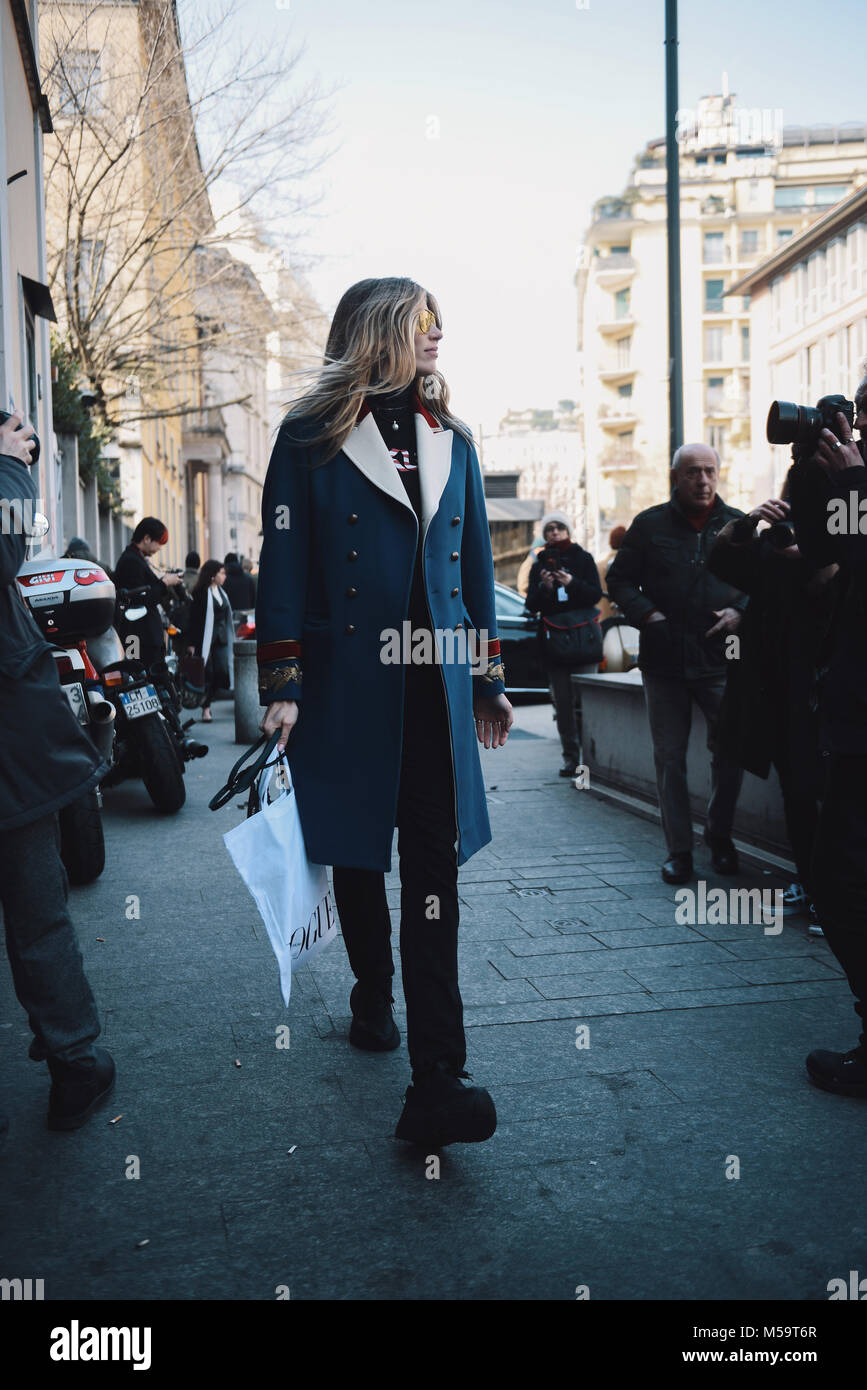 Milan, Italy. 21st Feb, 2018. Fashion girl posing to photographers ...