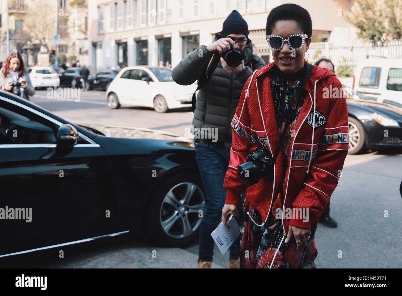 Milan, Italy. 21st Feb, 2018. Fashion girl posing to photographers ...