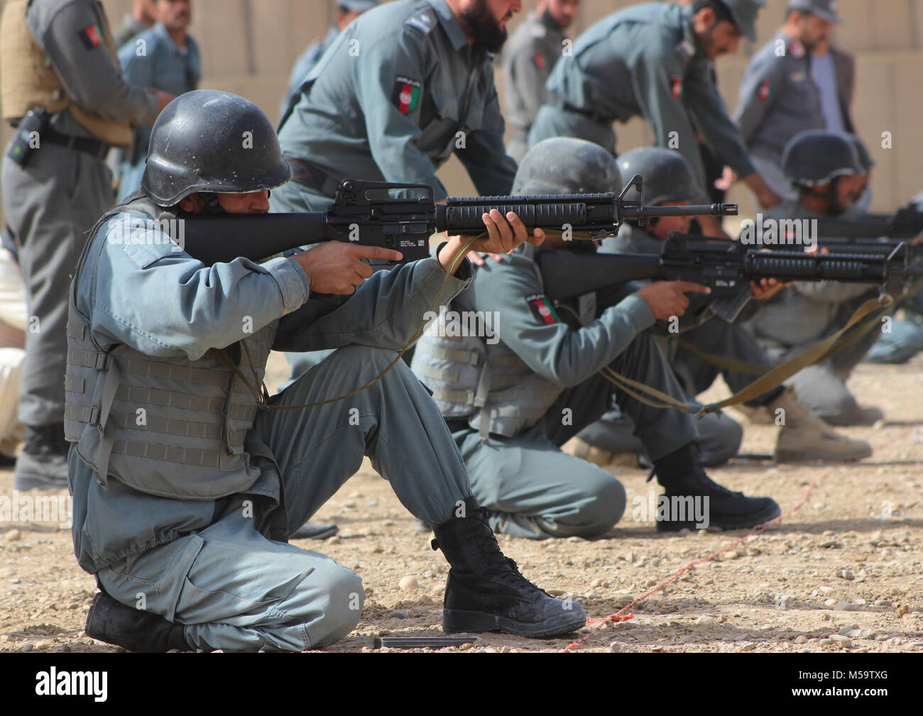 Lashkar Gah, Afghanistan. 20th Feb, 2018. Afghan policemen receive ...