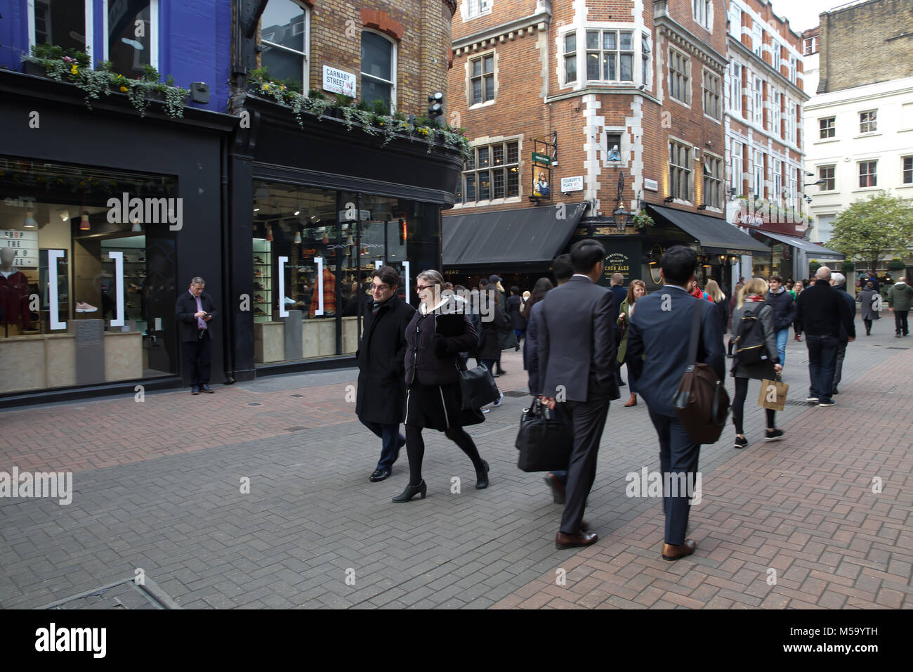 London, UK. 21st Feb, 2018. Dull and overcast day in London as people ...