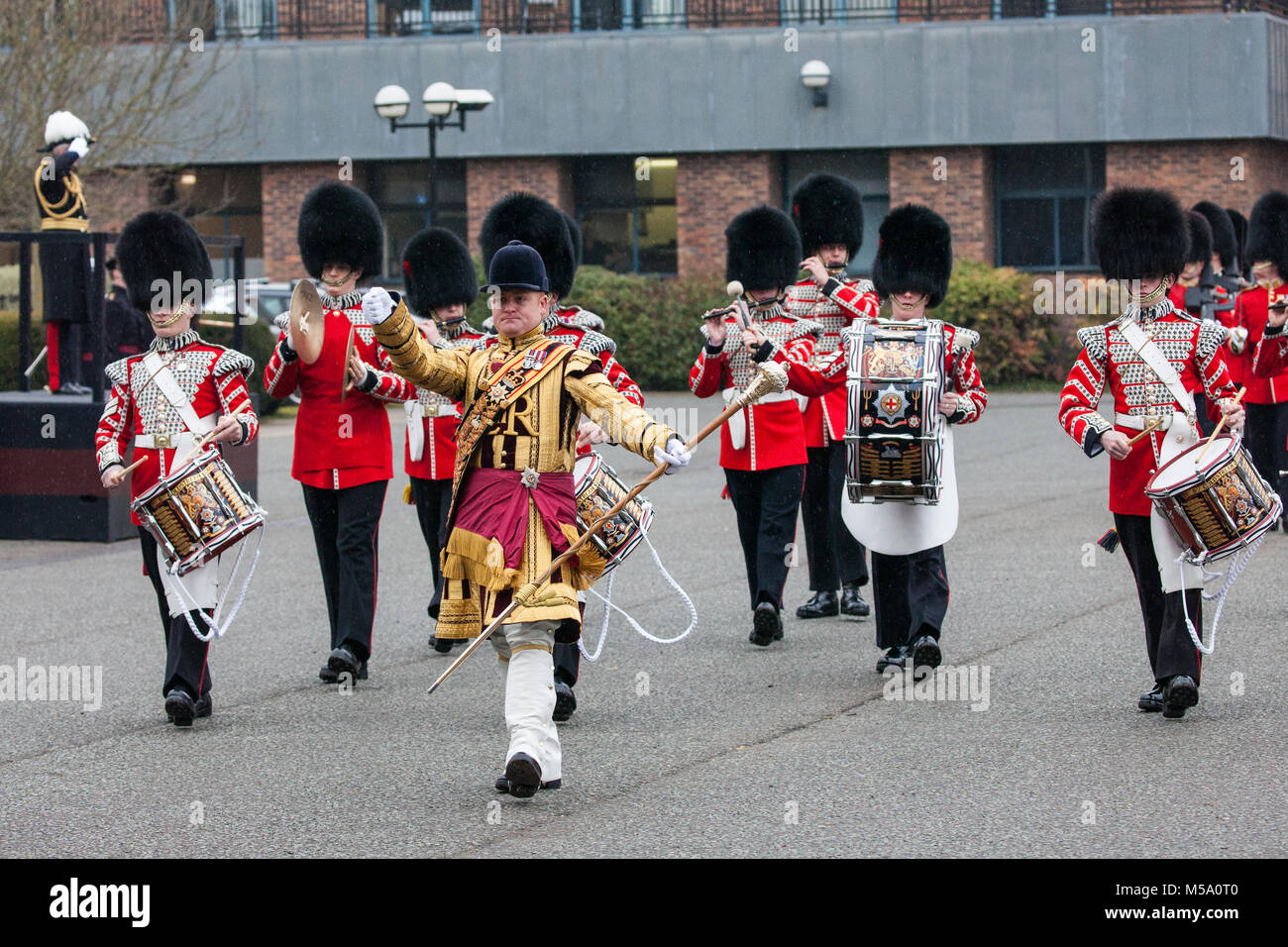 Windsor, UK. 21st February, 2018. Drum Major Liam Rowley leads the Drum ...