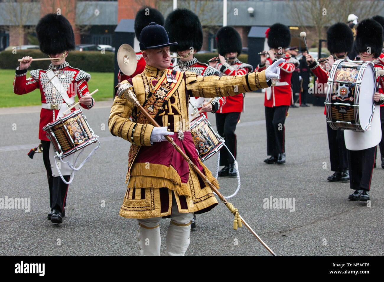 Windsor, UK. 21st February, 2018. Drum Major Liam Rowley leads the Drum ...