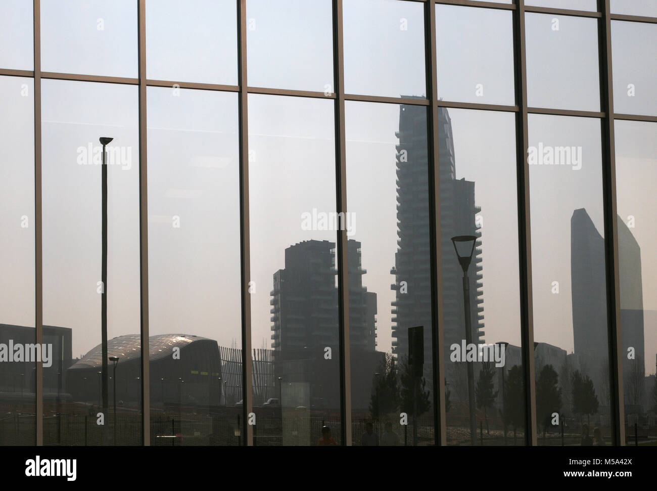 modern high rise buildings reflected in glass panels office building ...