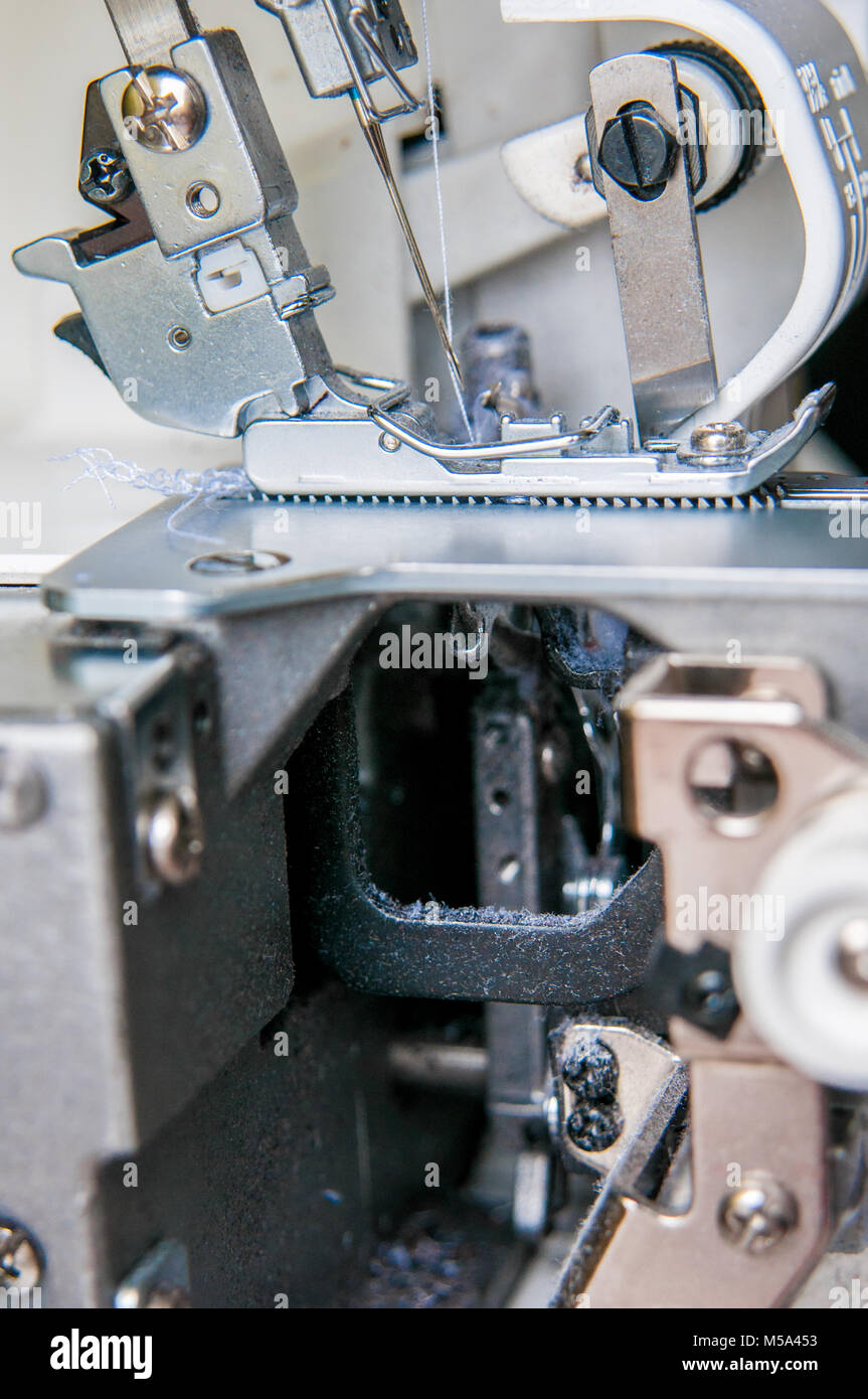 Modern Sewing machine with light flower pattern fabric Stock Photo - Alamy