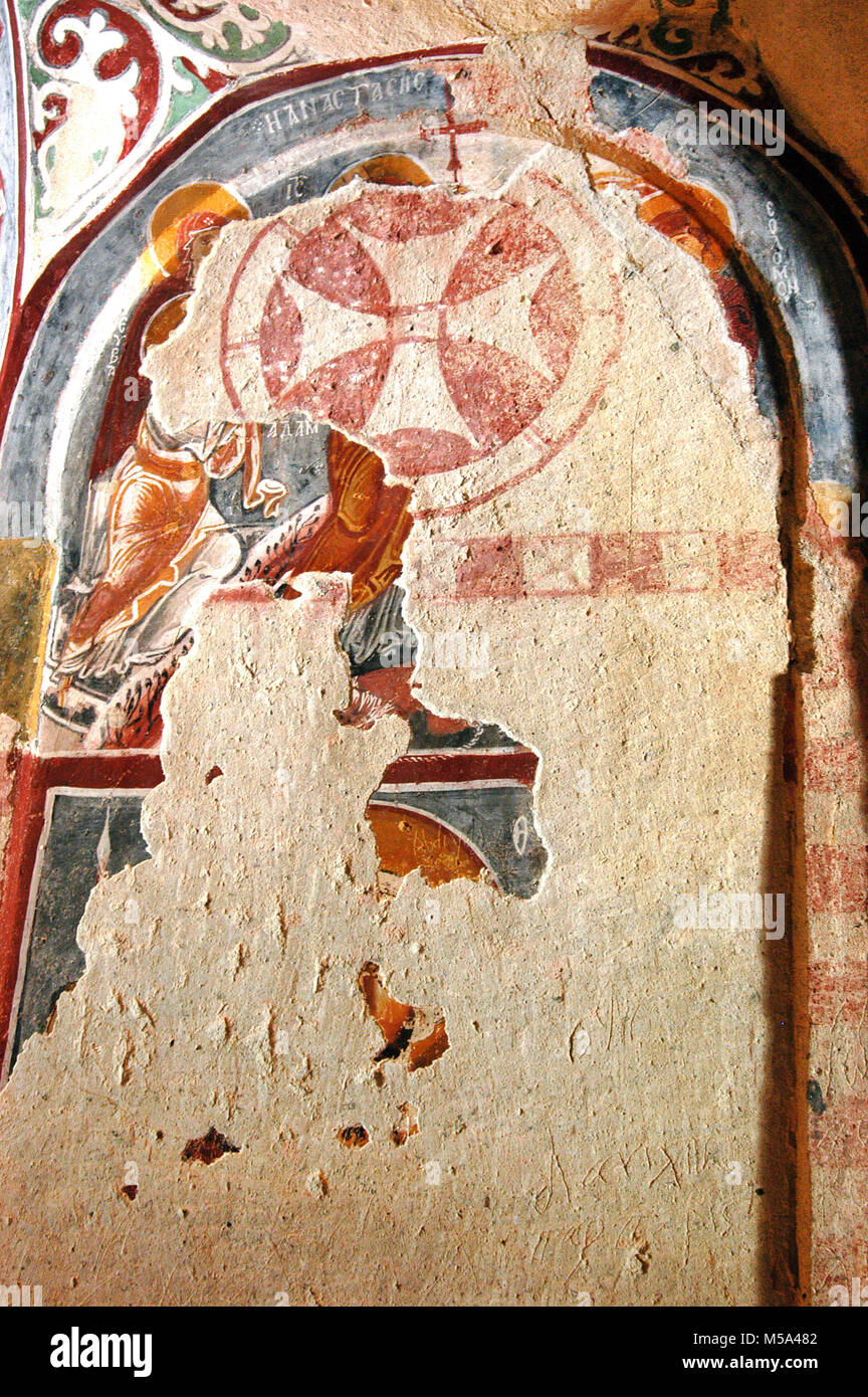 Layers of wall painting, fresco and mural in a cave chapel in ...