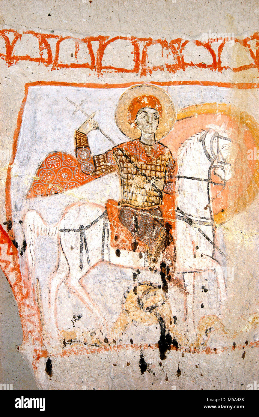 Saint George killing the dragon. Interior of a cave church with early ...