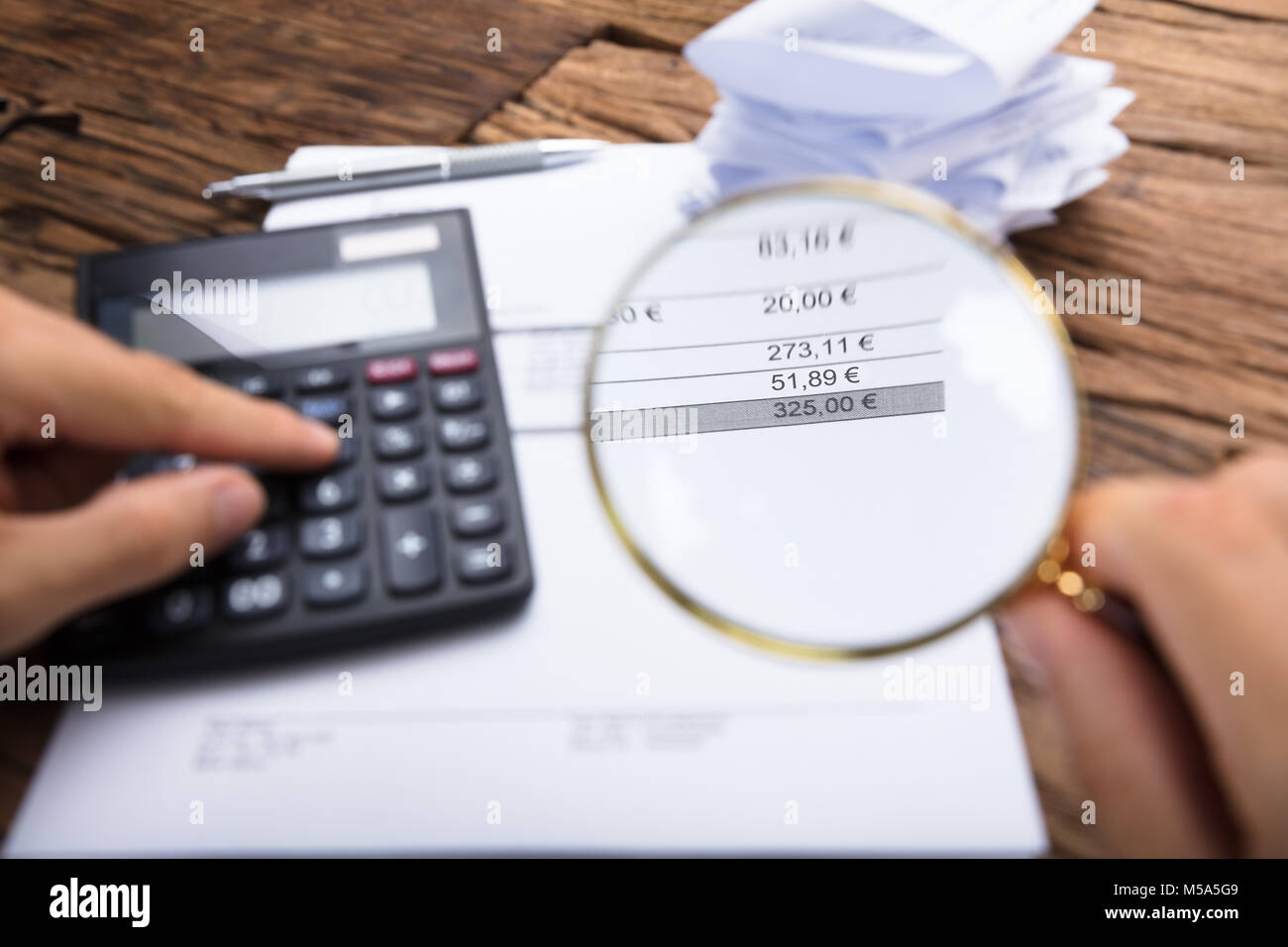 Pen magnifying glass calculator hi-res stock photography and images - Alamy