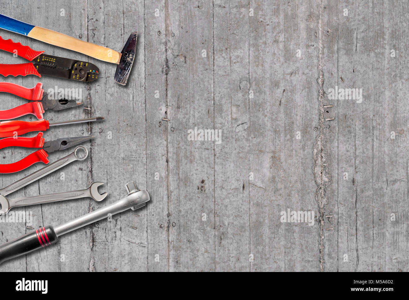 New rusty mechanic tools on concrete background Stock Photo - Alamy