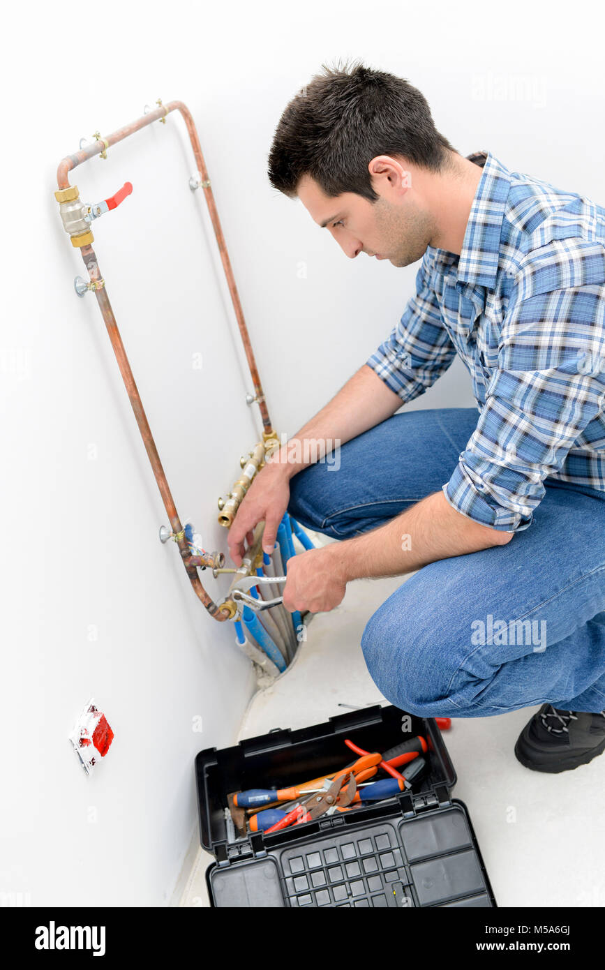 Plumber at work Stock Photo - Alamy