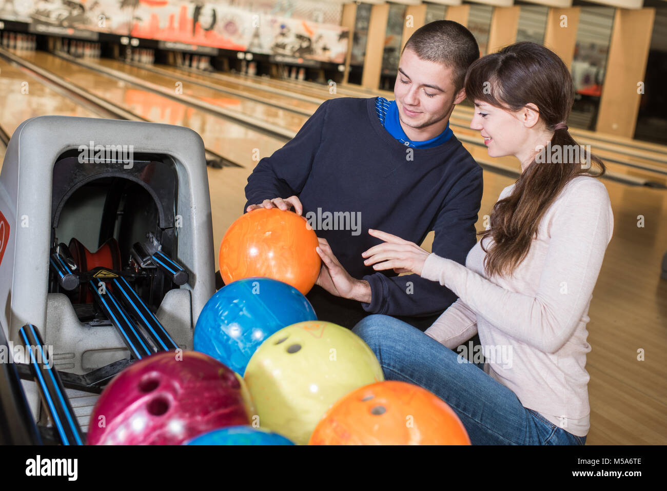 picture showing group of friends playing bowling Stock Photo - Alamy