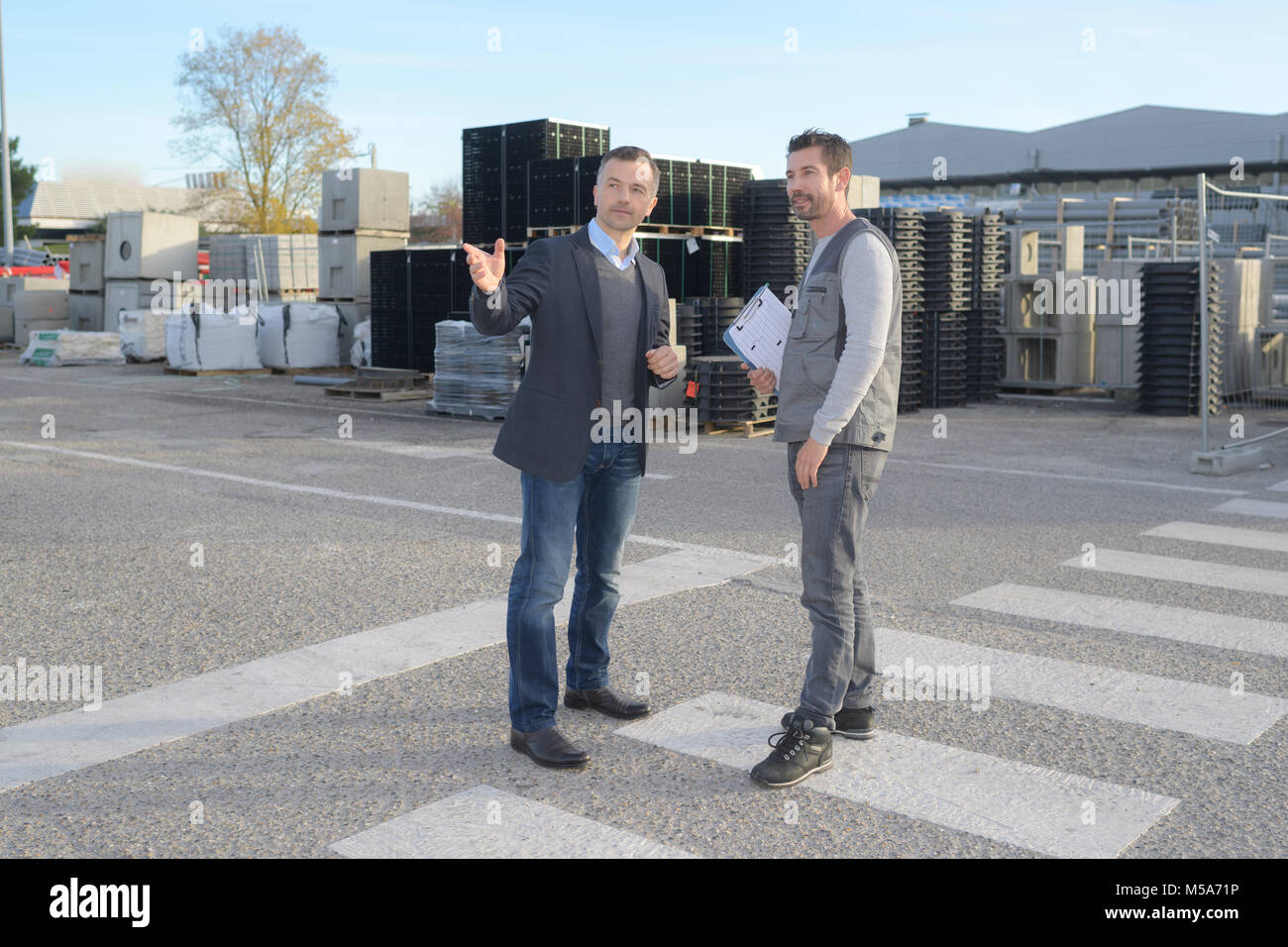 warehouse workers outside factory Stock Photo - Alamy