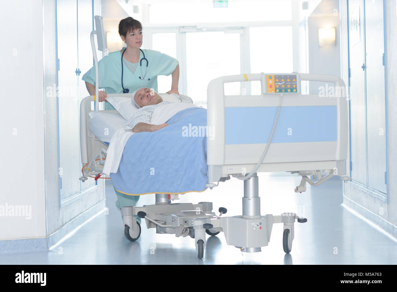 Nurse Wheeling Patient High Resolution Stock Photography and Images - Alamy