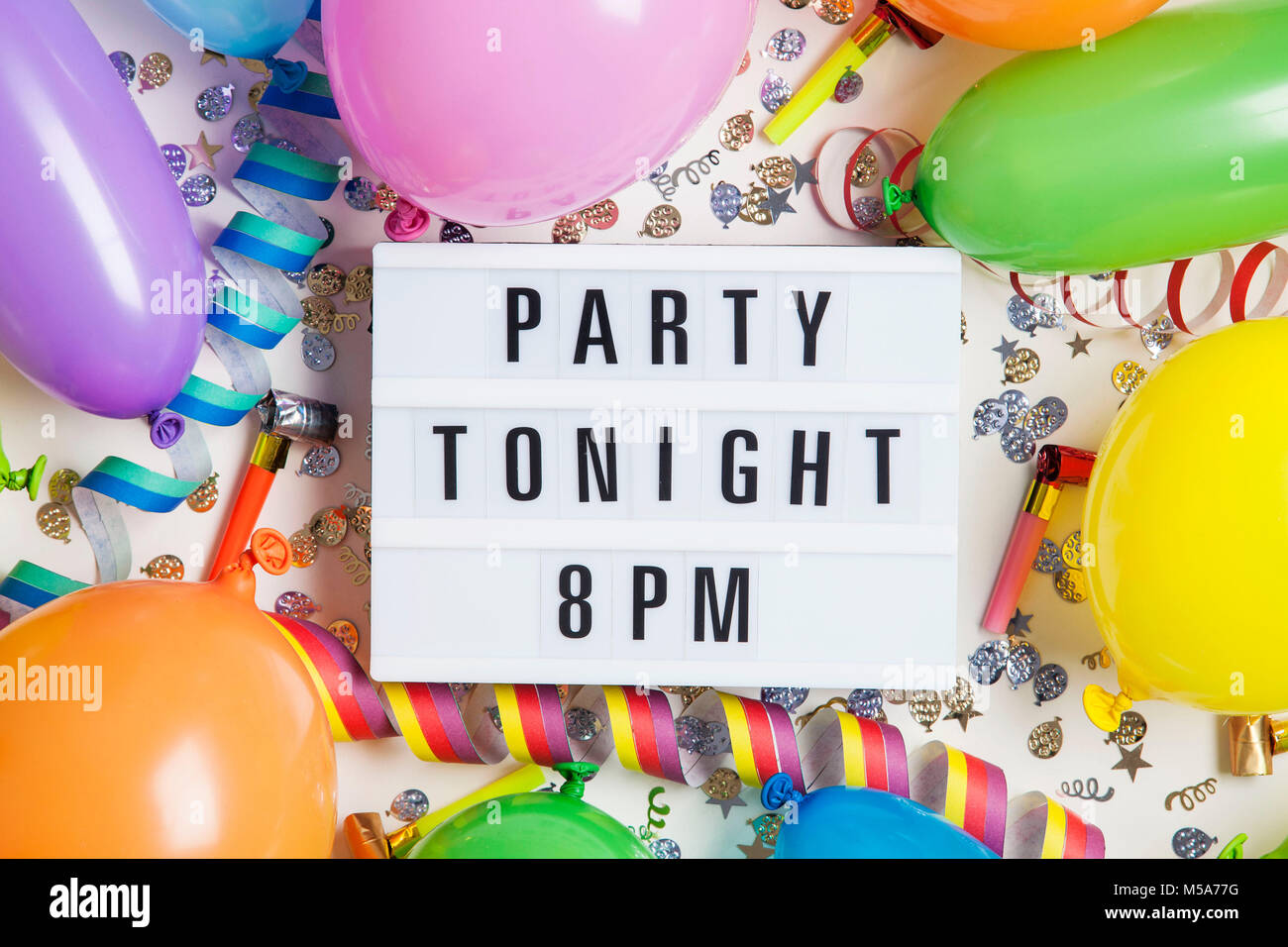 Party celebration background with party tonight message on a lightbox ...